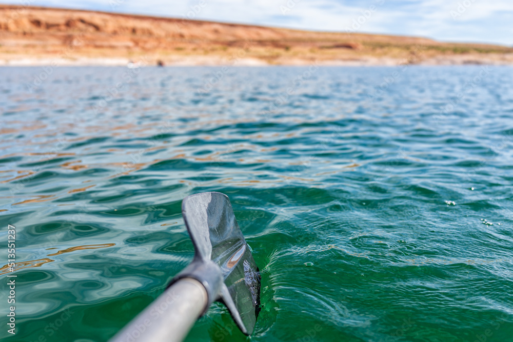 Kayaking in Lake Powell towards antelope canyon with closeup of paddle ...