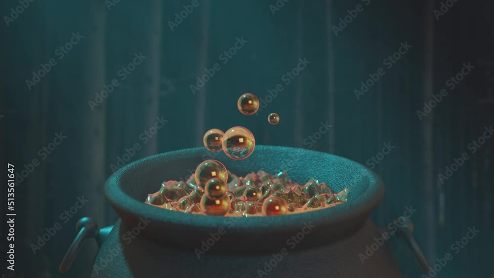 Boiling potion with bubbles in black metal cauldron in the forest. Loop ...