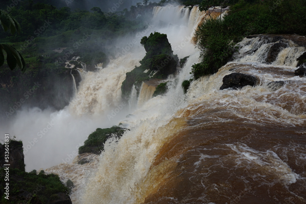 The photo shows a stunning view from the top of the Iguazu Falls — a ...
