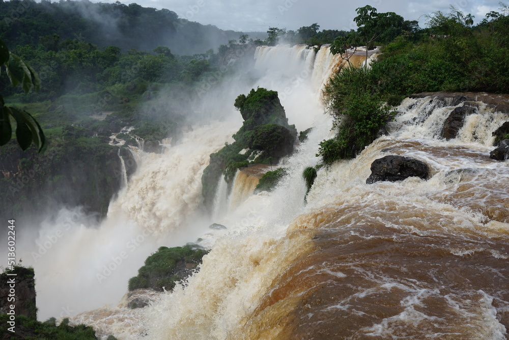 The photo shows a stunning view from the top of the Iguazu Falls — a ...
