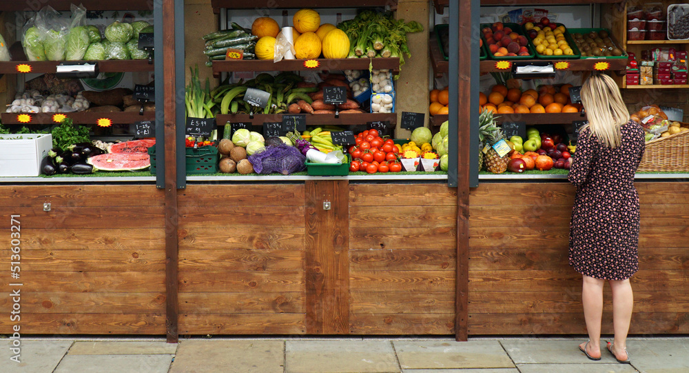 Fruit and Vegetable outside stall with female customer. Stock Photo ...