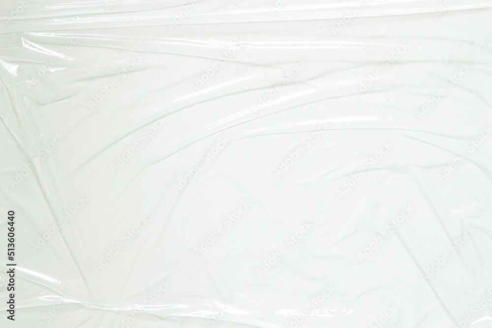 Transparent plastic wrap on white color background. Crumpled wrinkled ...