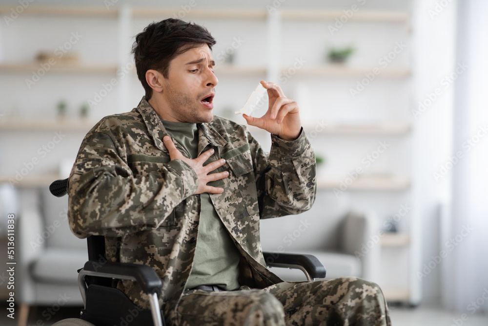 Injured military man suffering from panic attack, using inhaler Stock ...