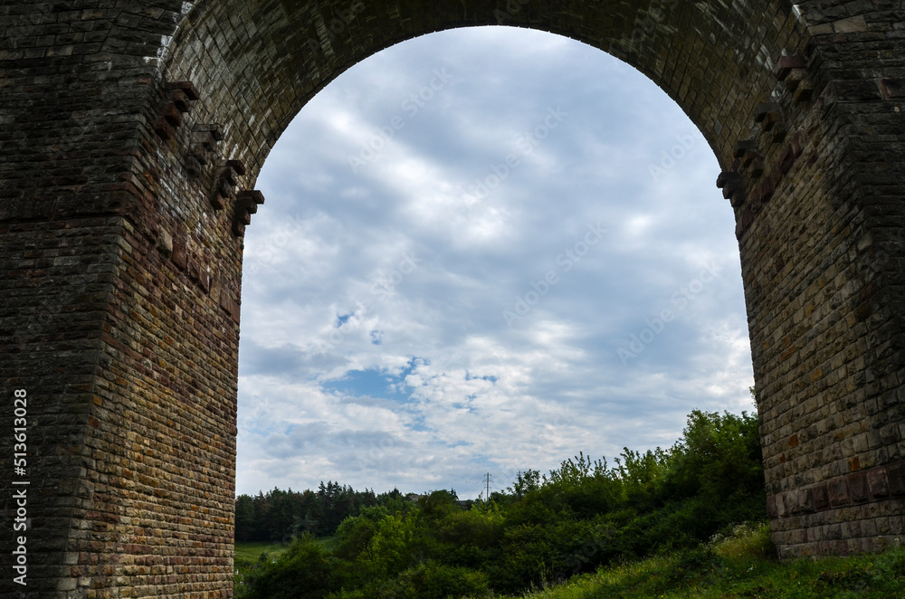 Arch of ancient stone viaduct railway bridge built in the time of ...