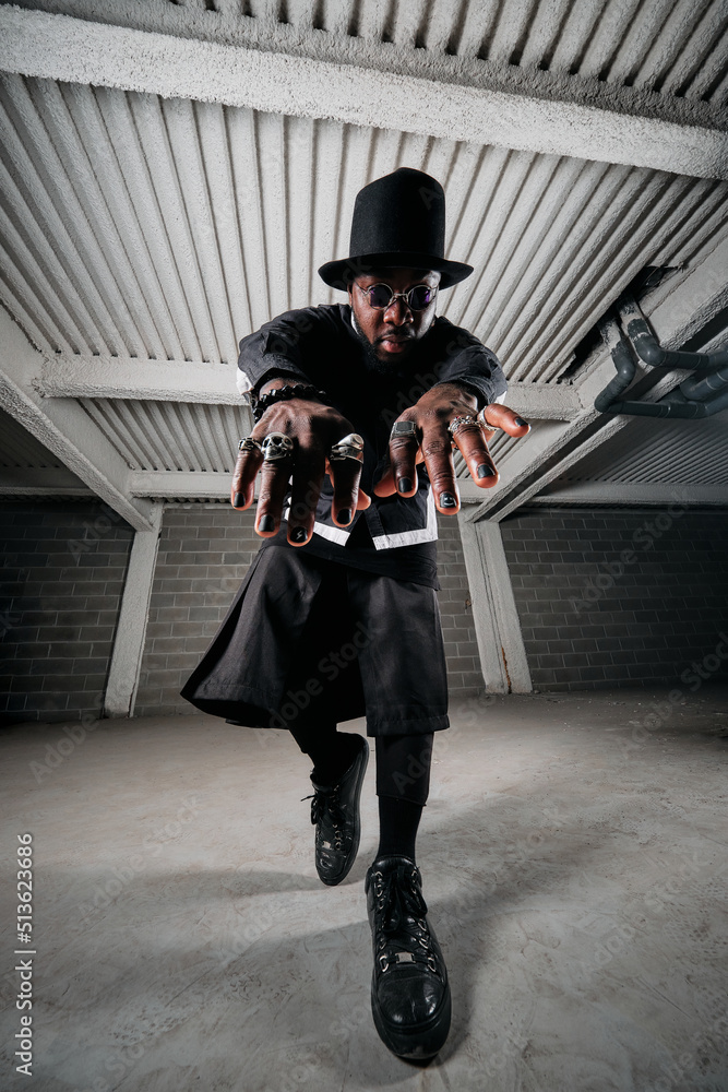 From below full length of serious African American male dancer in ...