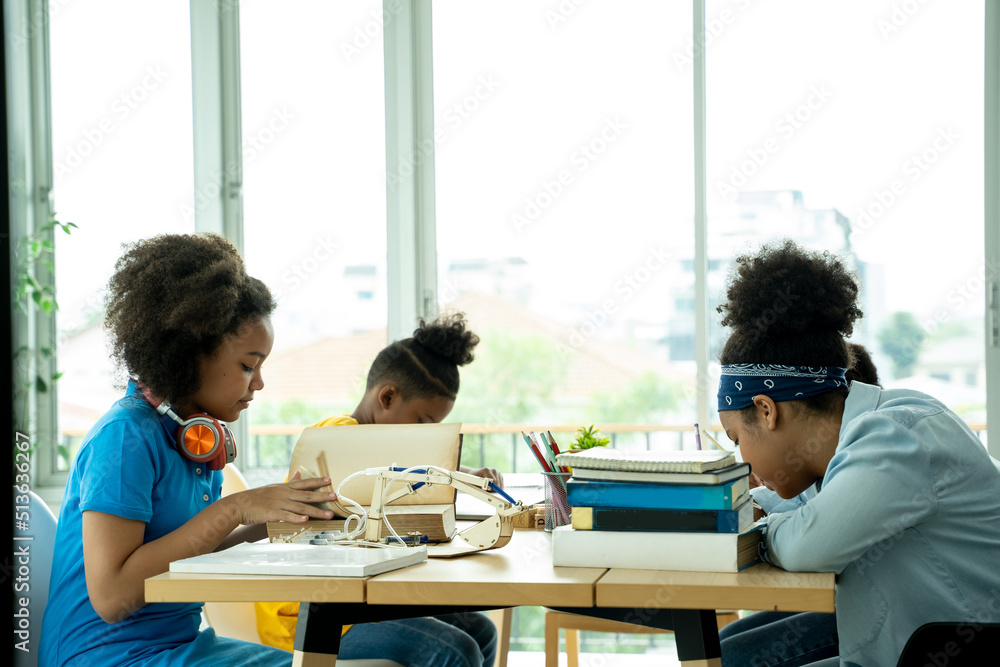 African American girl school children studying together in classroom ...
