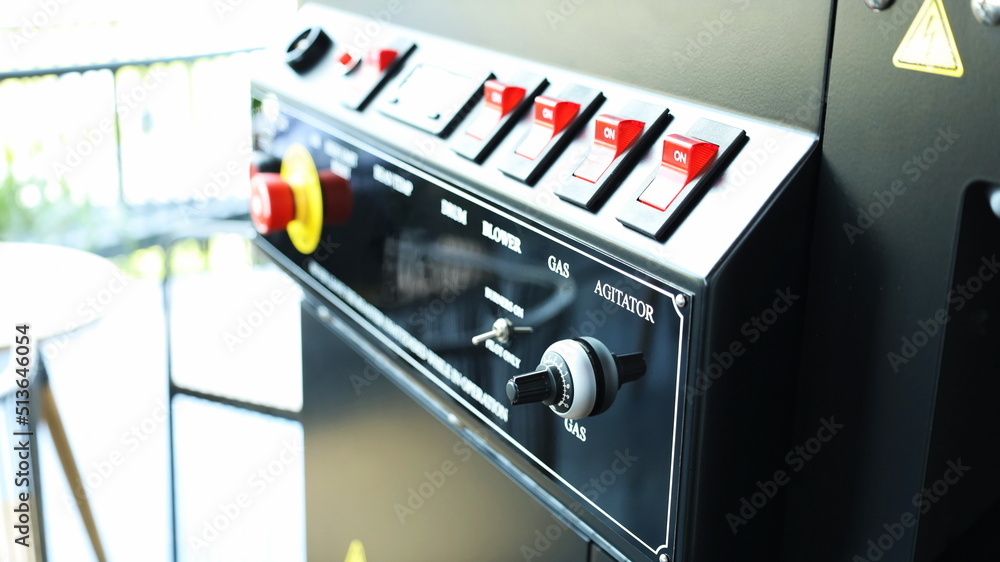 Switch of the coffee roaster. Close-up of various controls on a coffee ...