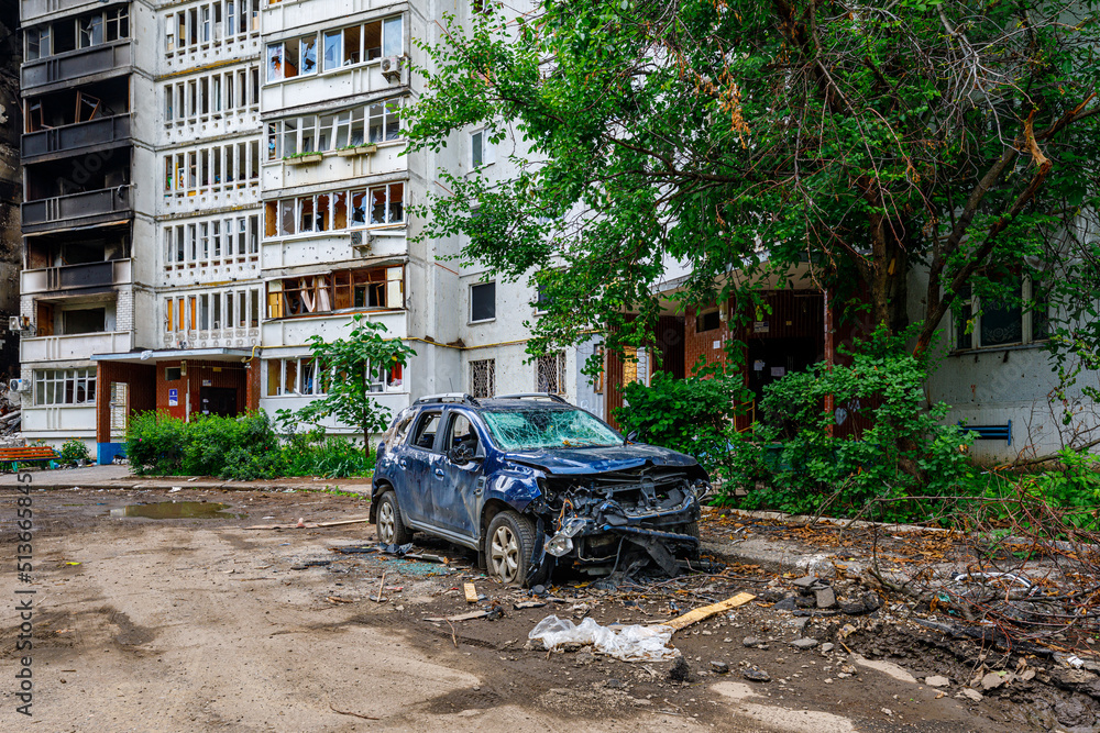 civilian car destroyed by Russian troops under the rubble. Residential ...