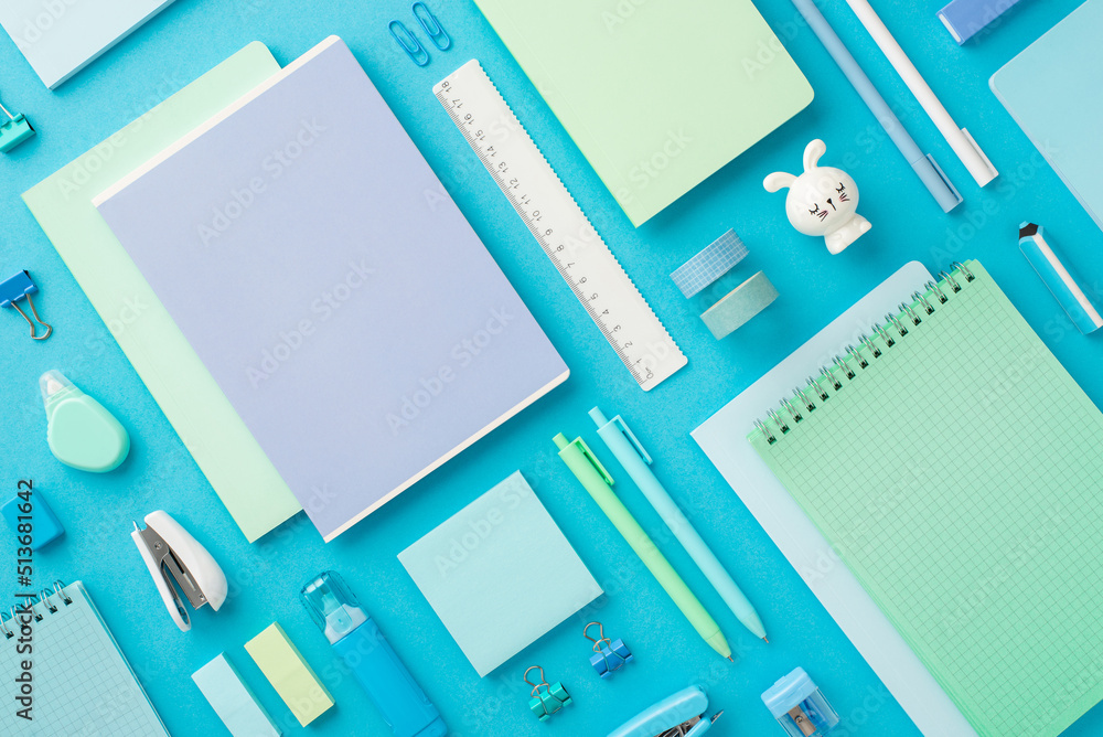 Back to school concept. Top view photo of colorful notepads bunny ...