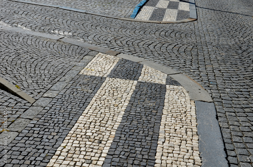 mosaic of small marble cubes. sidewalks and squares formed by stone ...