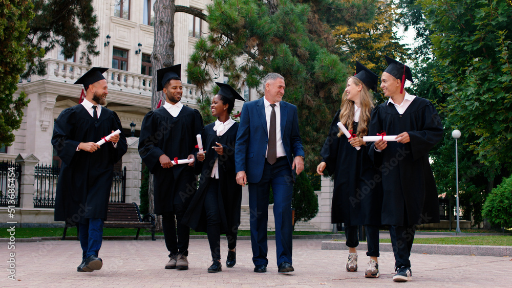 Walking in front of the camera graduates students multiracial and their ...