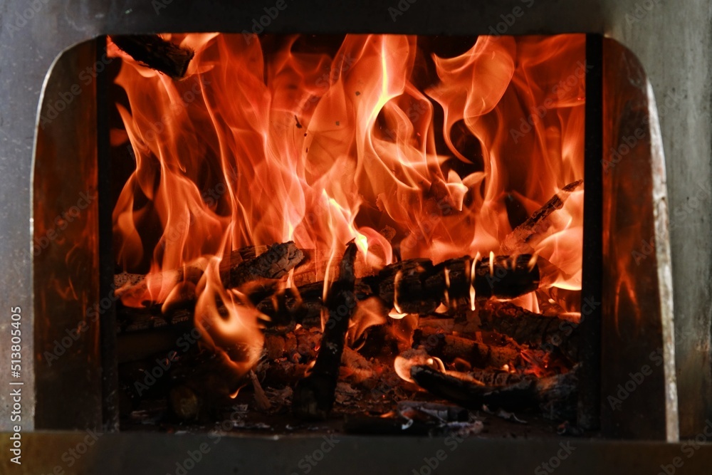Fire flames from a wood stove fire isolated on a black background Stock ...