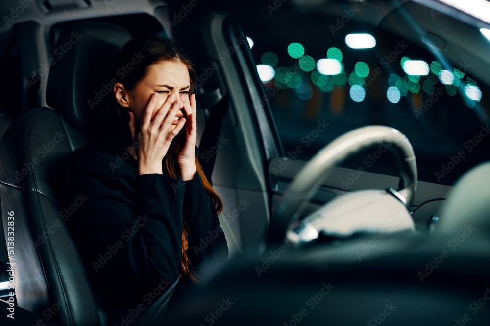 a frustrated, emotional, crying woman is sitting behind the wheel of a ...