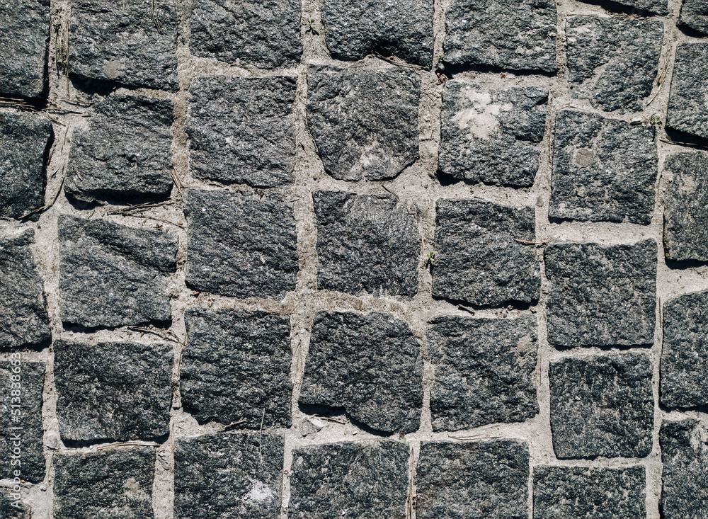 Texture of dark gray granite paving stones, top view. Background from ...