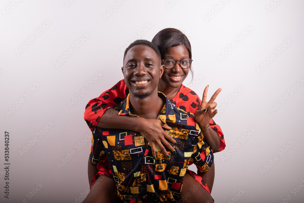 Girlfriend on the back of their boyfriend pose for a photo in the ...
