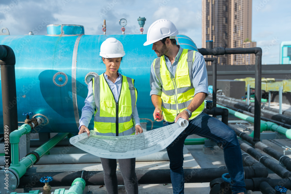 Engineer under checking the industry chilled water fan coil unit air ...