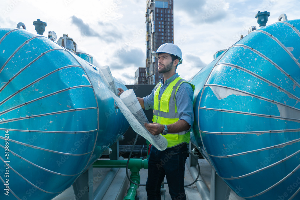 Engineer under checking the industry chilled water fan coil unit air ...