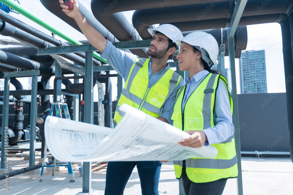 Engineer under checking the industry chilled water fan coil unit air ...