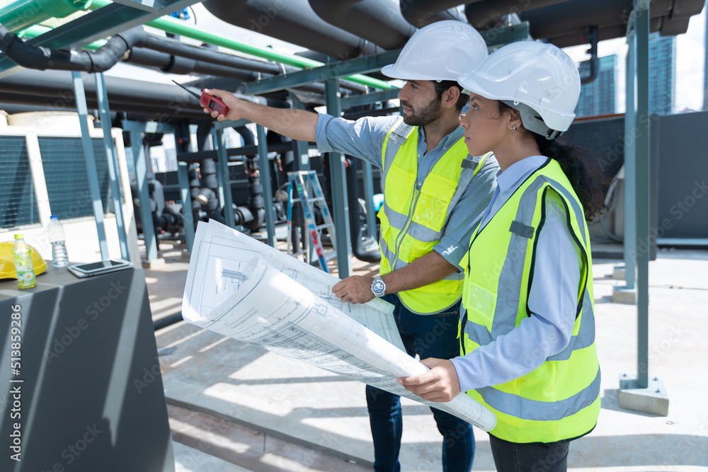 Engineer under checking the industry chilled water fan coil unit air ...