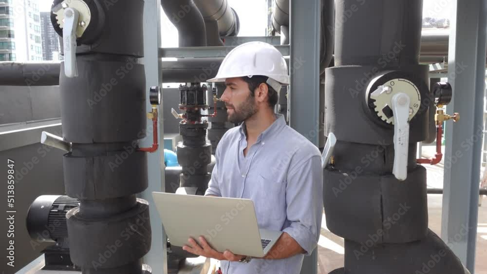 Engineer under checking the industry chilled water fan coil unit air ...