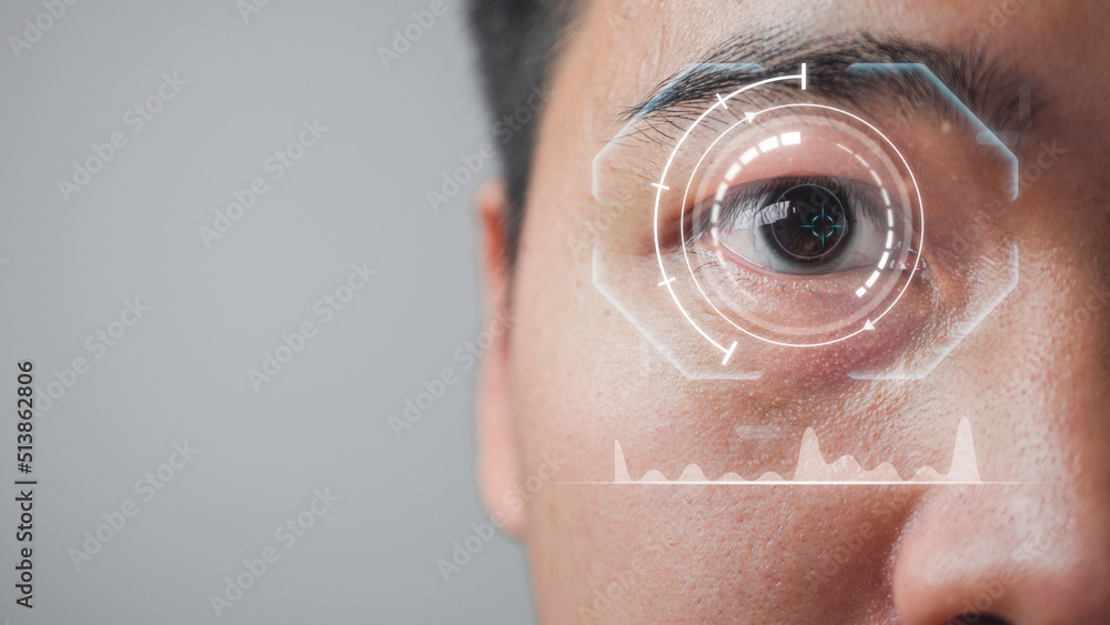 Biometric technology concept. The man uses his eye to access and ...