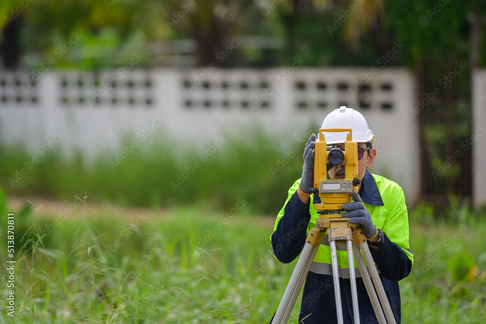 Male civil engineer surveying with theodolite apparatus Before ...