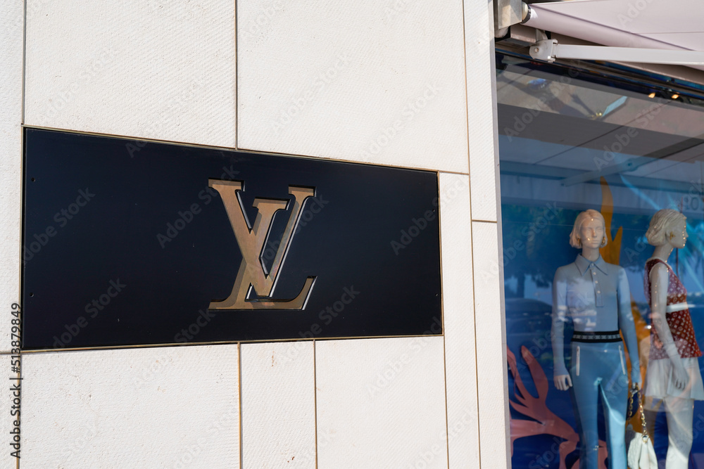 louis vuitton logo brand and sign text front entrance up store fashion ...