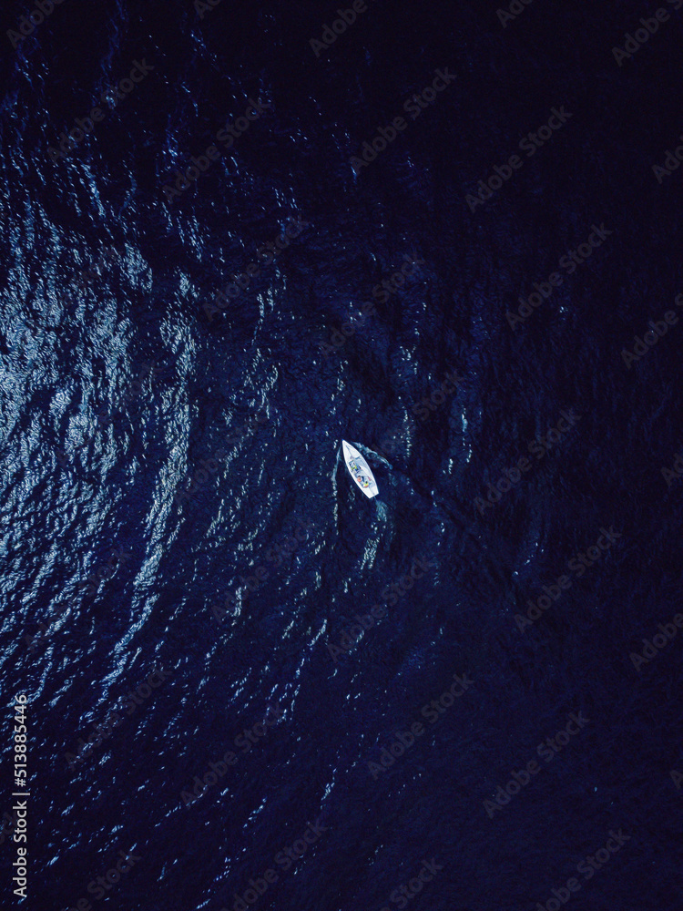 lonely boat on the ocean Stock Photo | Adobe Stock lonely boat on the ocean Stock Photo | Adobe Stock