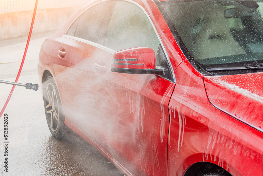 Red car wash with pressure jet side doors and rear view mirror. Stock ...