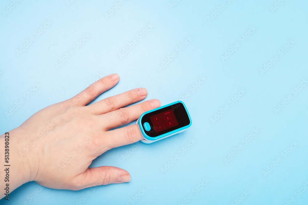 pulse oximeter on the finger to measure the level of hemoglobin in the ...