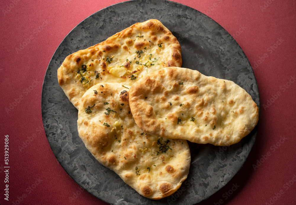 Naan (Indian flat bread) Stock Photo | Adobe Stock