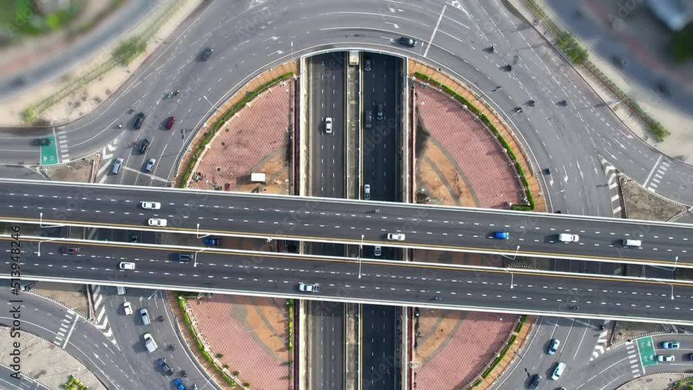 Stockvideon 4K : Top view of Tunnel under the interchange roundabout ...