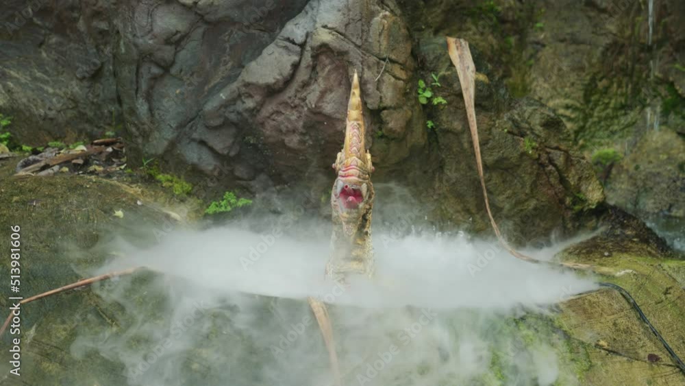 4K Cinematic slow motion footage of a golden Naga Payanak Snake statue ...