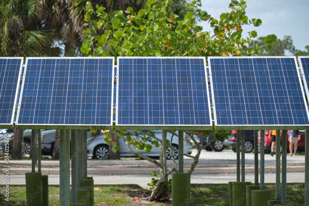 Solar panels installed on stand frame near parking lot for effective ...