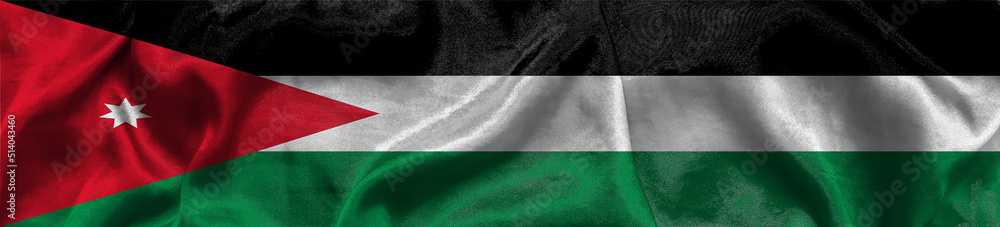 Elongated national flag of Jordan with a fabric texture fluttering in ...