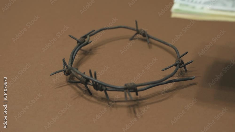 Dollars are placed in a circle of barbed wire. Symbol of corruption ...