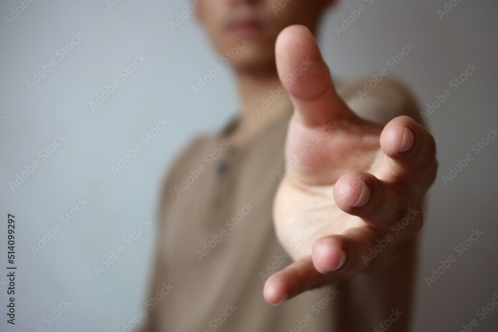 Opened hand giving some help. Young man offering helping hand. Banner ...