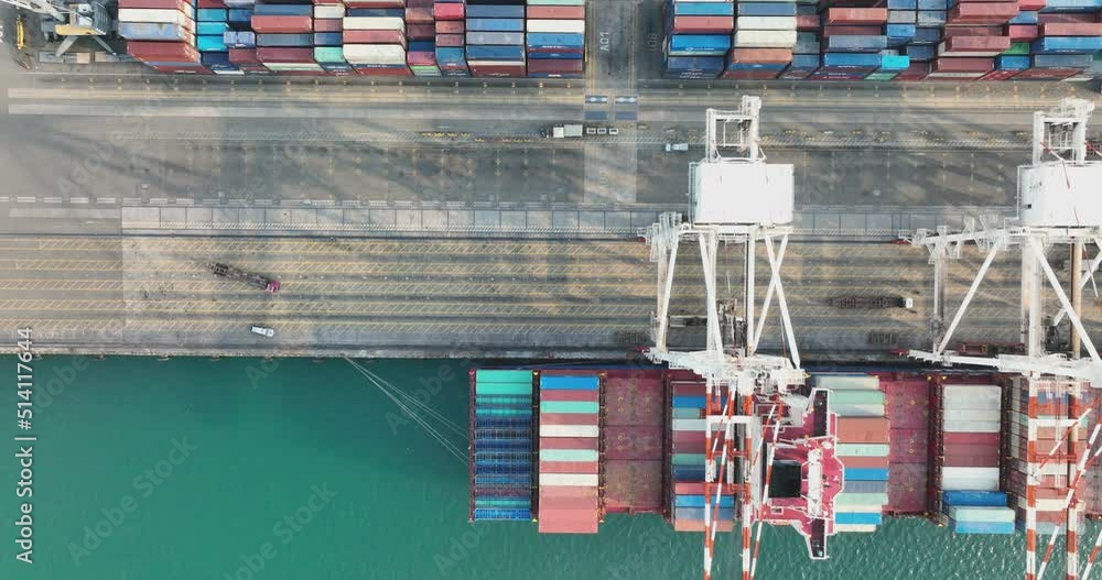 Aerial top view of cargo vessel ship loading and unloading in deep sea ...