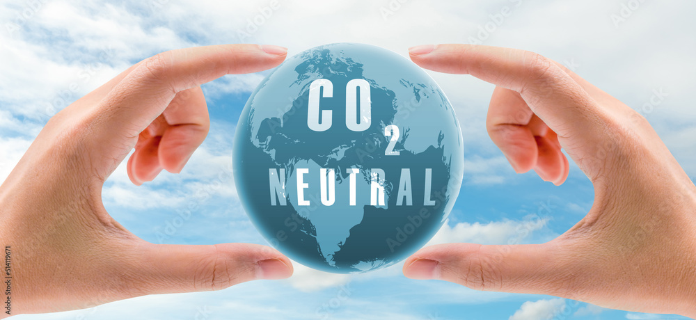 Carbon neutral concept. Hand holding CO2 neutral in globe map on blue ...