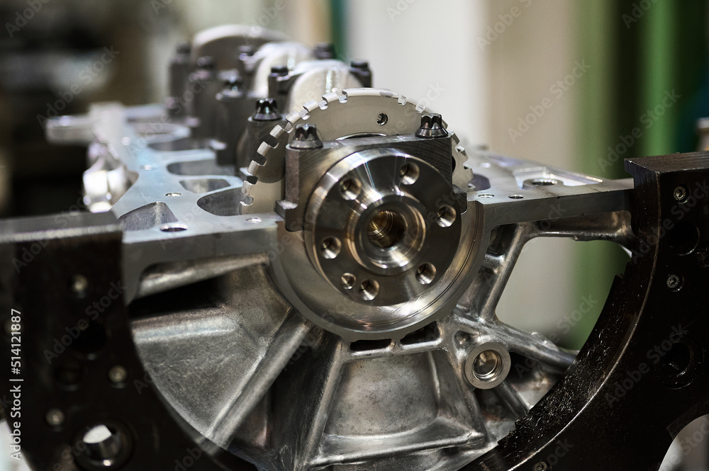 Cylinder block complete with crankshaft. Assembly line of internal ...