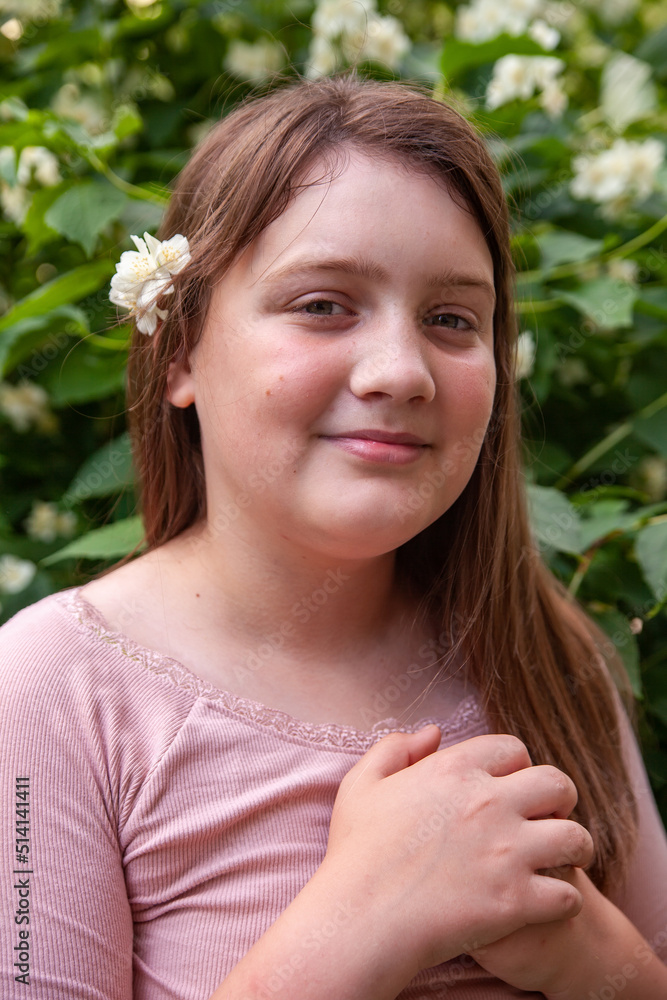 Cute teenage girl outside in summer garden Stock Photo | Adobe Stock