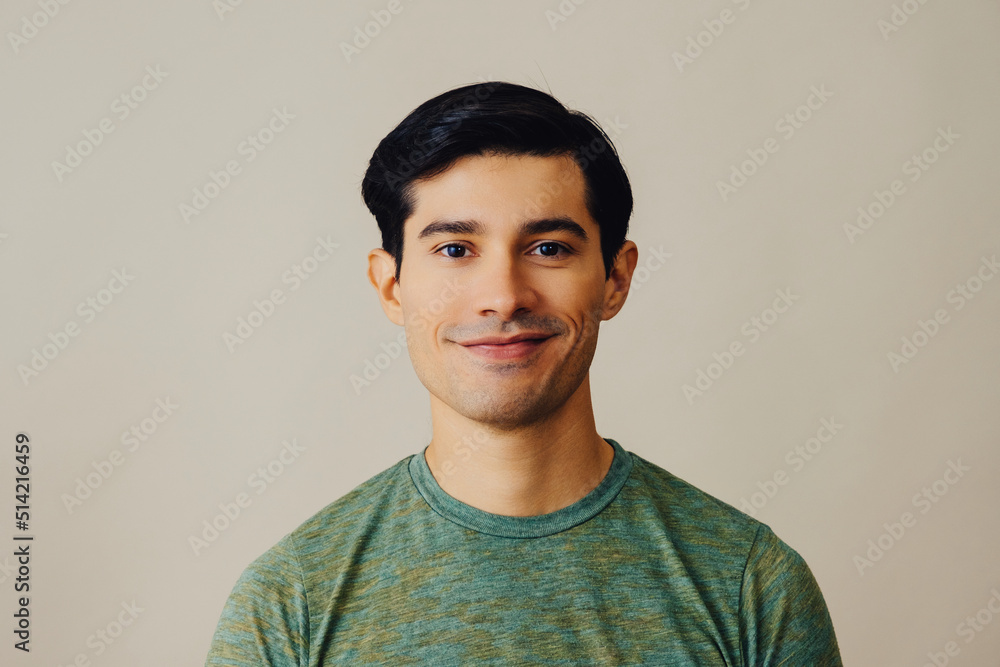 Headshot latino man black hair smiling handsome young adult green t ...