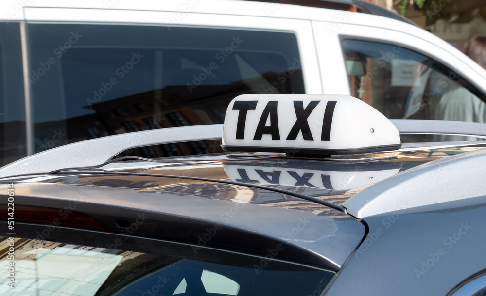 Simple traditional taxi cab car roof top sign, white object up close ...