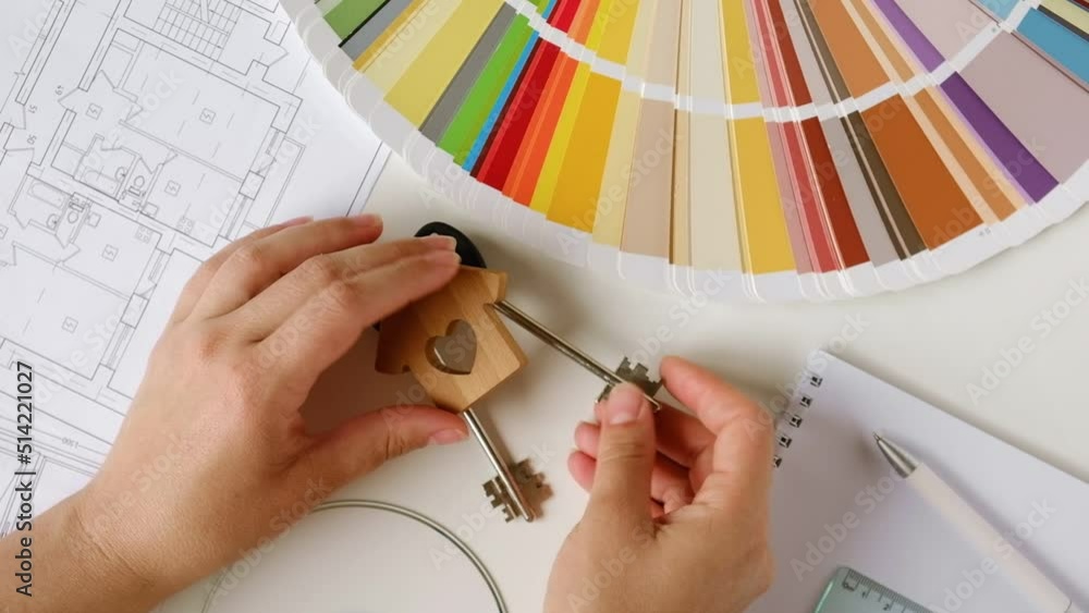 Hands choosing Colors of Interior Design from the Color Guide ...