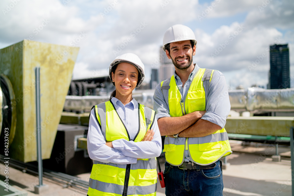 Portrait of two professional engineer or technician workers stand and ...