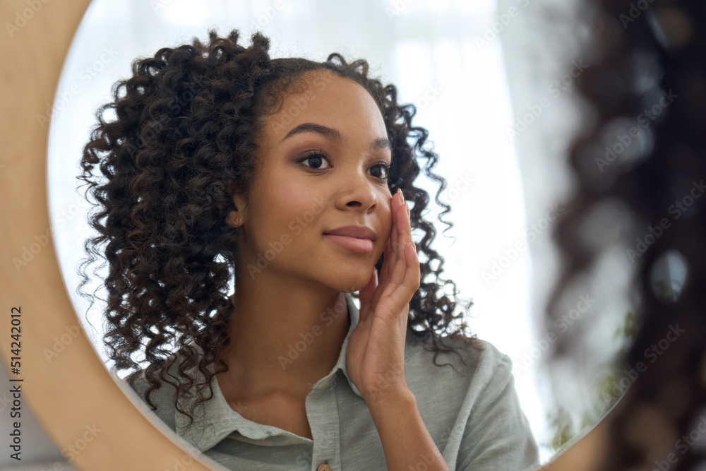 Photo & Art Print Beautiful teen African American girl looking in mirror reflection touching ...