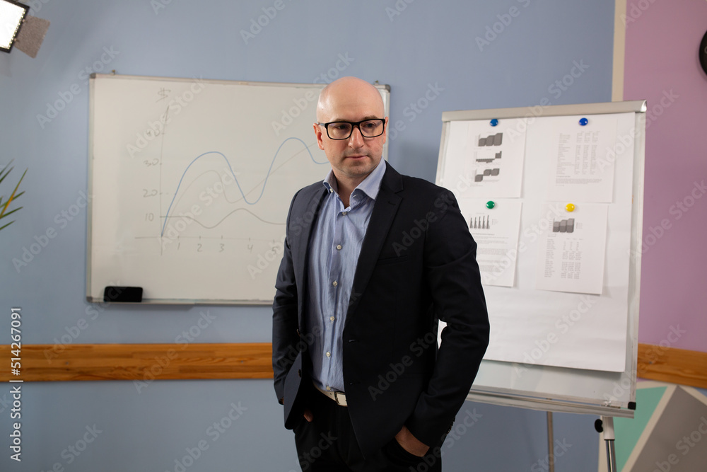 Portrait young man team leader with smiling face posing in office ...
