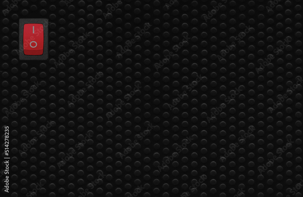 Red rectangle rocker power switch in on position, black abstract dot ...