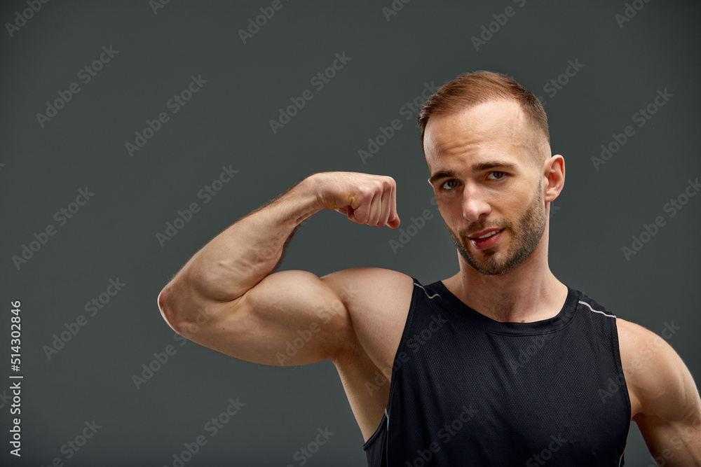 Portrait of a handsome young guy model with hairstyle in a trendy black ...