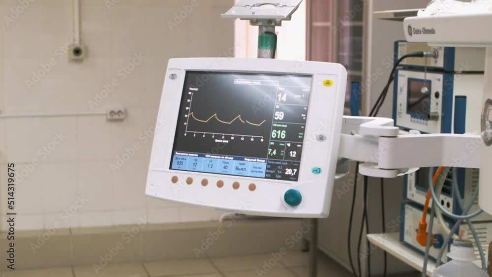 Modern medical operation room with monitor. Graphic lines on the screen ...